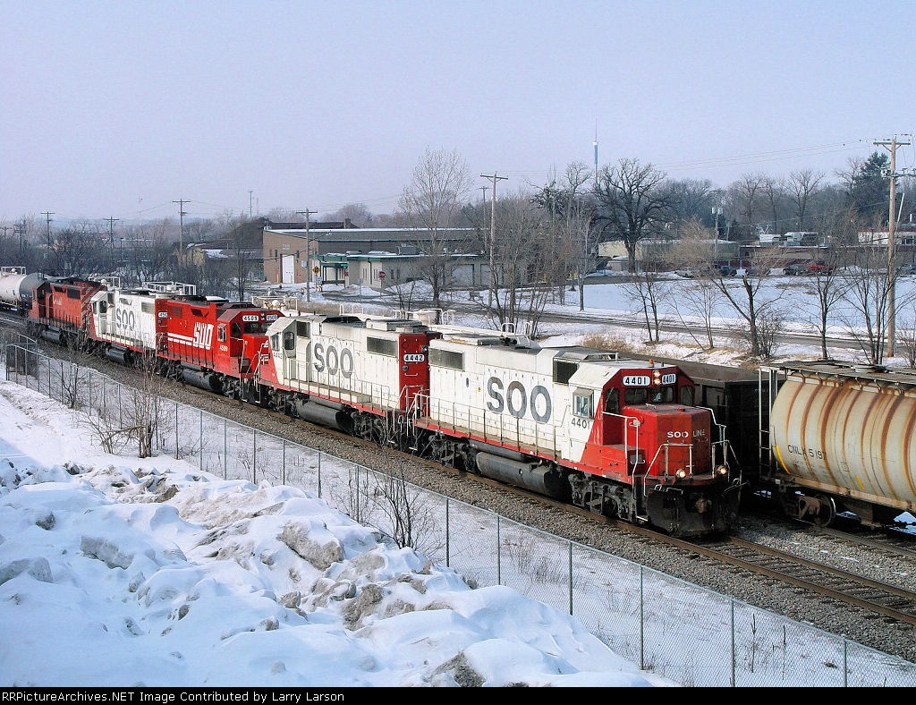 SOO 4401 leads a quartet of SOO GP38-2s and a CP SD unit east back to St. Paul Yard